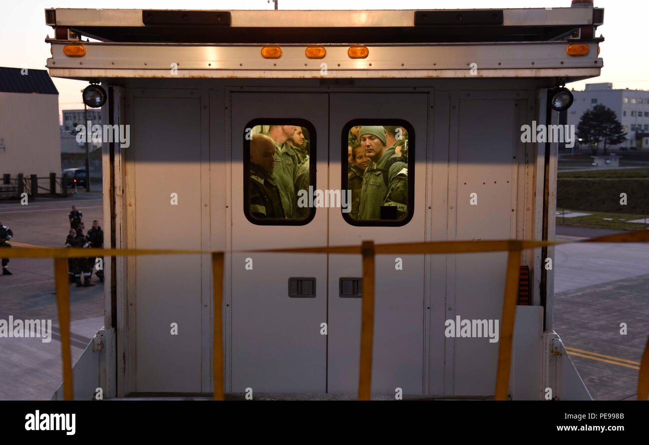 U.S. Air Force Airmen are lowered to the ground in a high deck patient ...