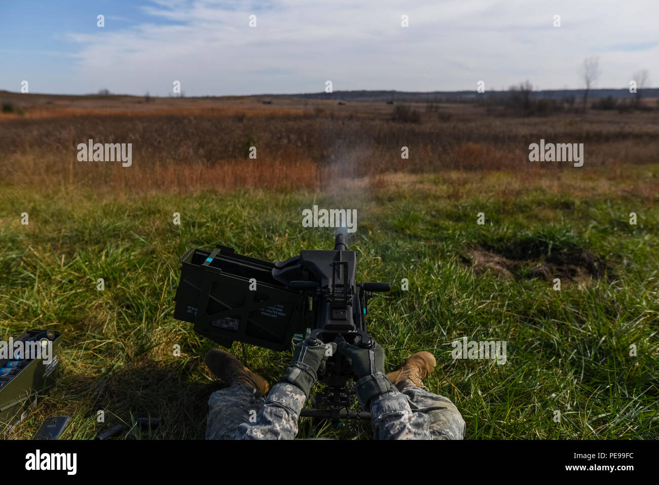 A U.S. Army Reserve military police Soldier fires a MK19 machine ...