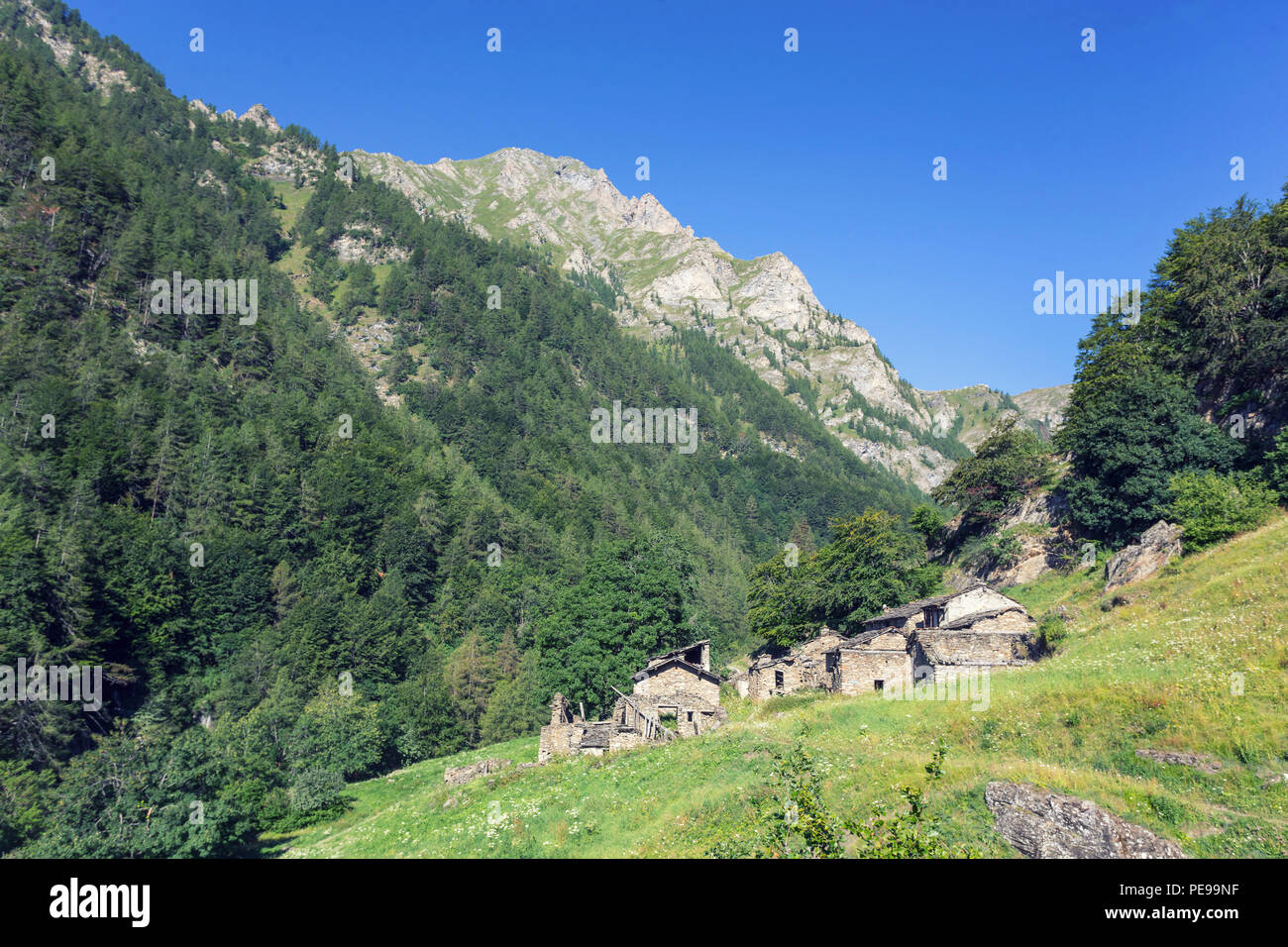 abandoned village in alps mountains full of different houses and ...