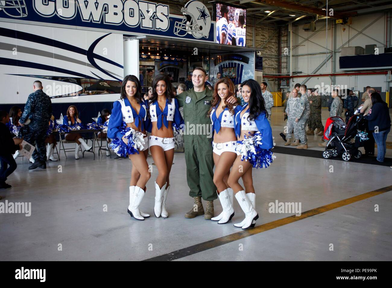 Cheerleaders from the Dallas Cowboys take pictures and sign autographs ...