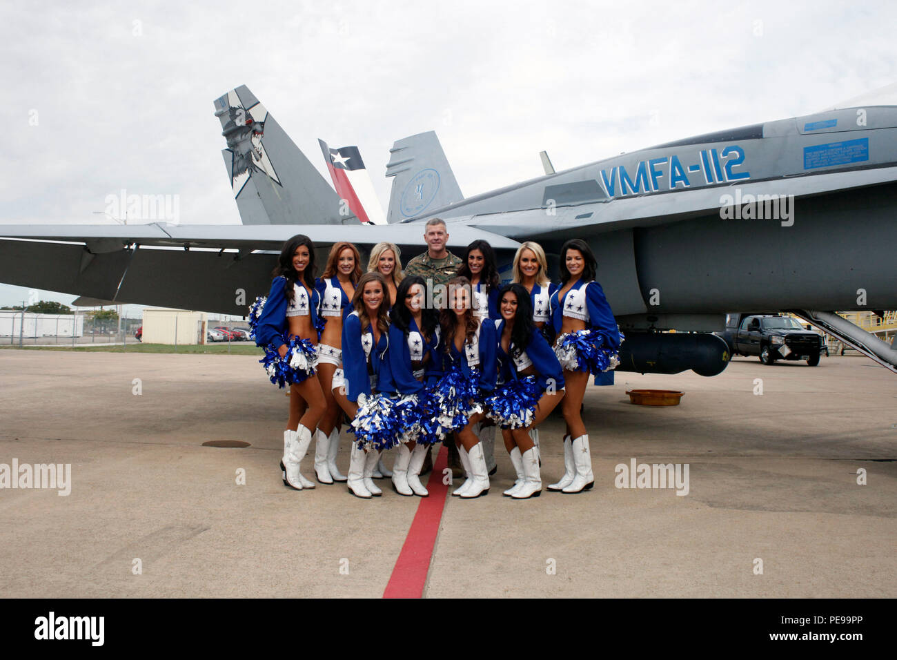 Dallas Cowboys cheerleaders pose with Col. Paul T. Patrick, commanding ...