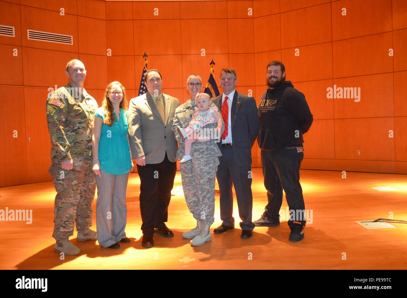 Sgt. Maj. Elsa Gaver stands with her family after her promotion at the ...