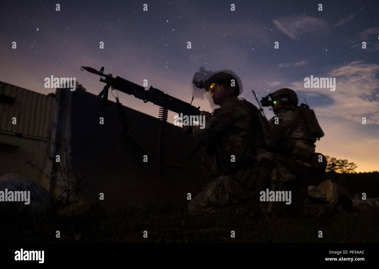 U.S. Army soldiers conduct security during a night mission as part of ...
