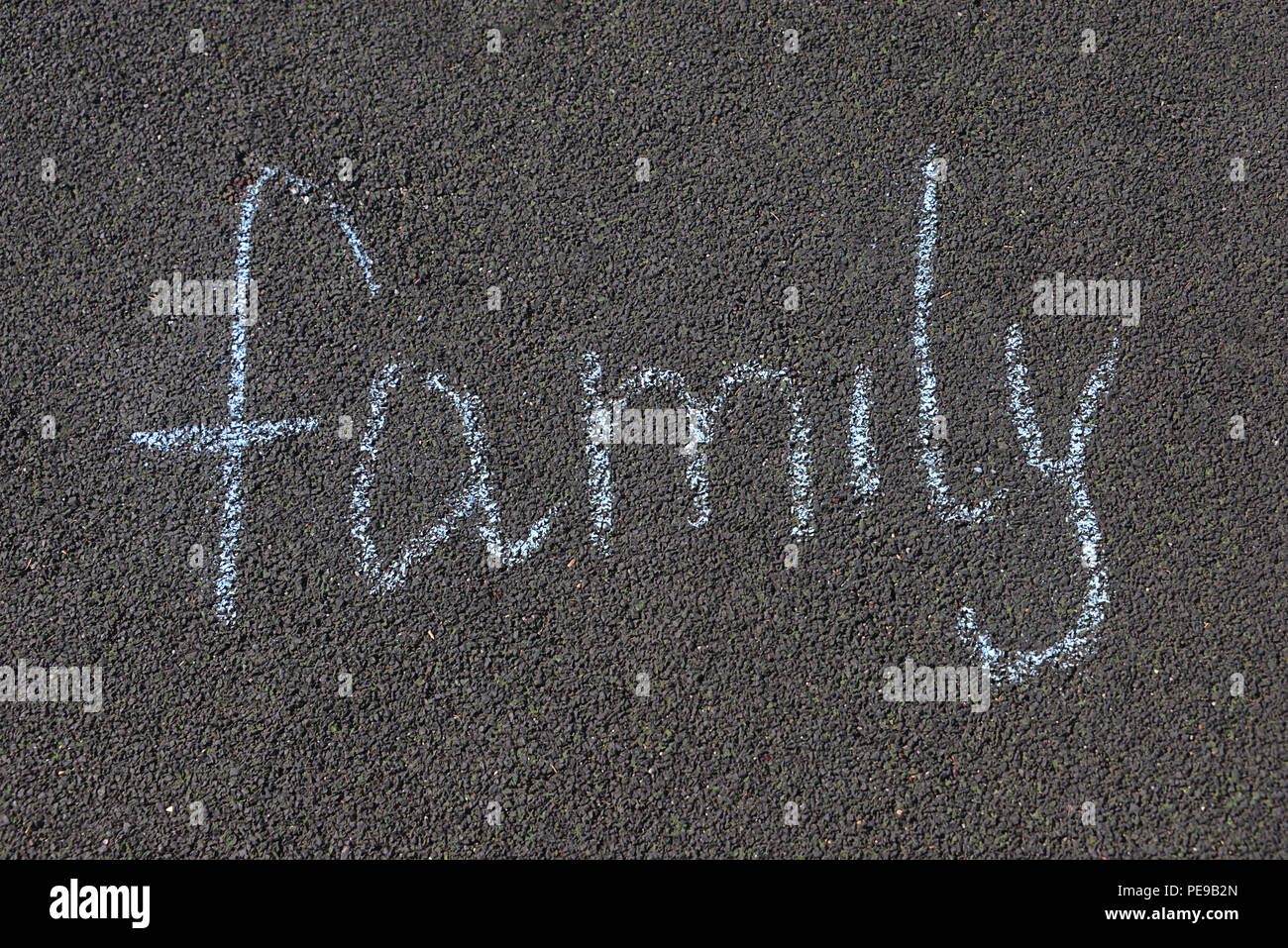 inscription on the asphalt family, chalk written Stock Photo - Alamy