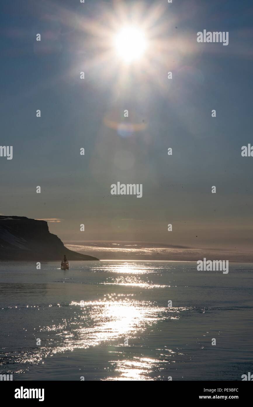 taken from the back of the ship at Midnight in the Arctic sea, where ...