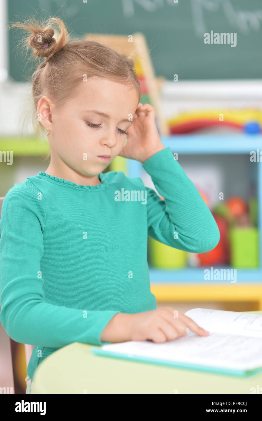 Portrait of a cute happy schoolgirl studying Stock Photo - Alamy
