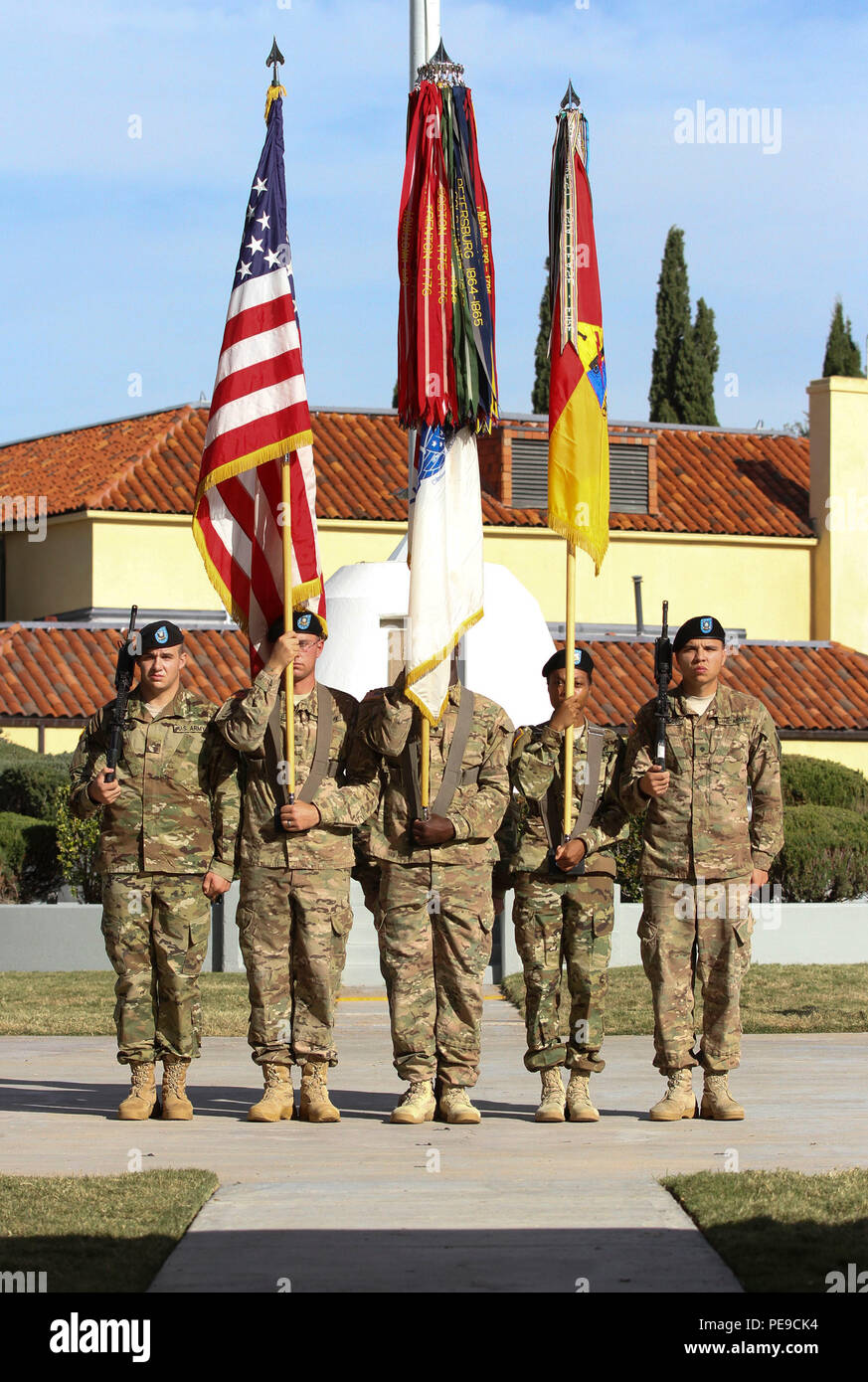 The 1st Armored Division color guard stands at attention for the ...