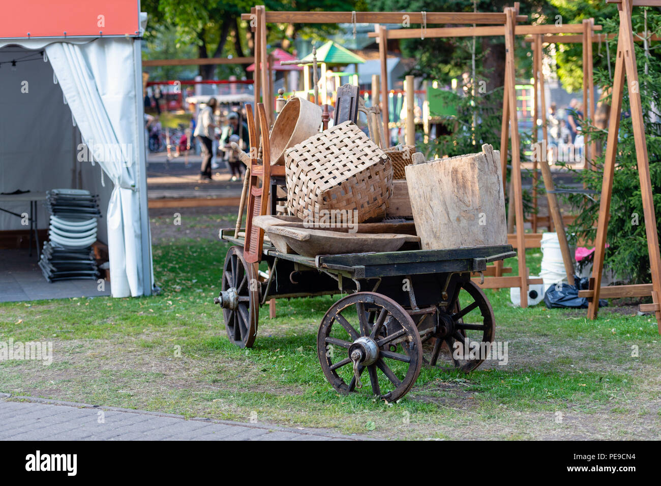Traditional folk craftsmen market. Old horse carts with various ...
