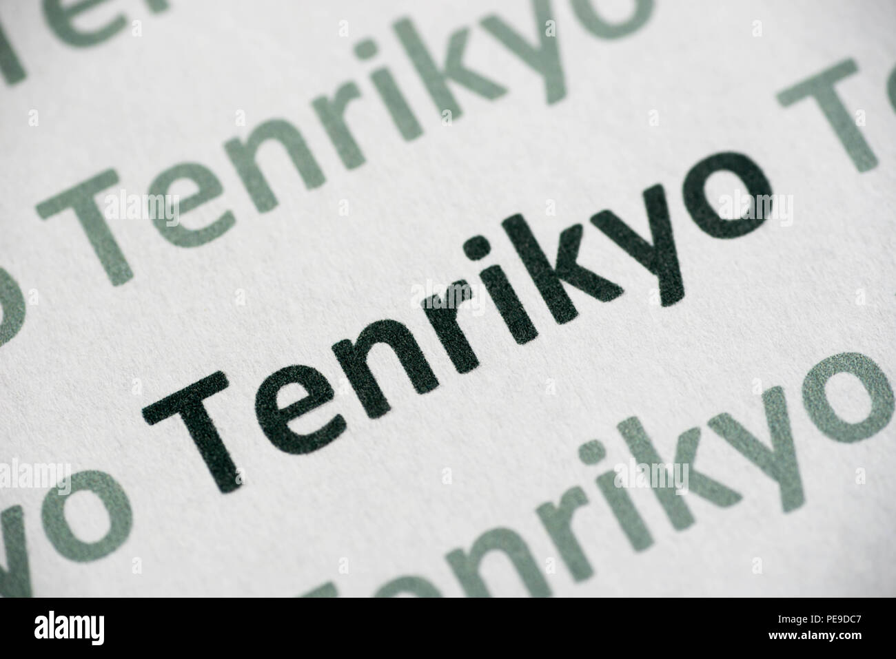 word Tenrikyo printed on white paper macro Stock Photo - Alamy