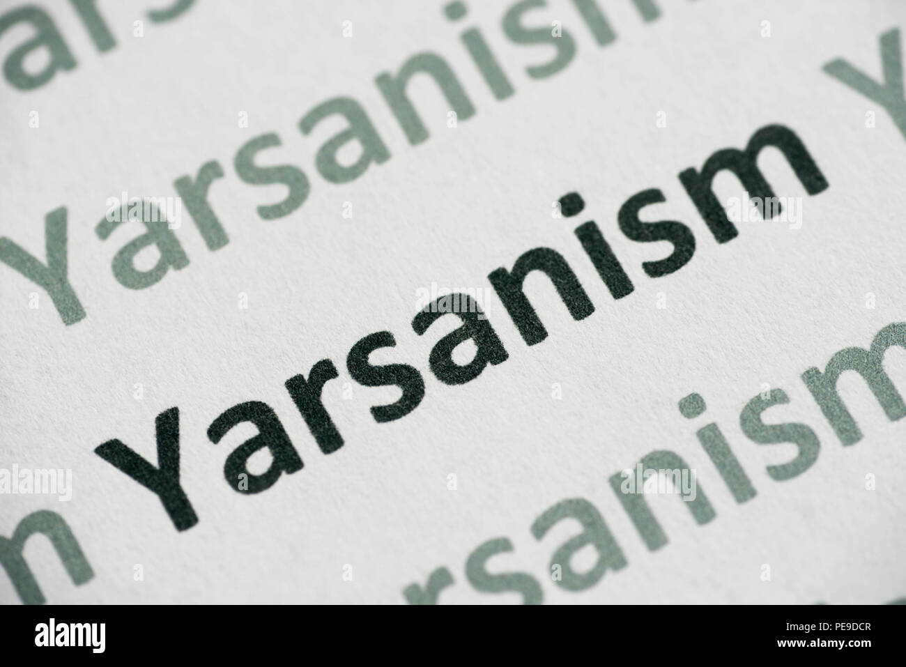 word Yarsanism printed on white paper macro Stock Photo - Alamy