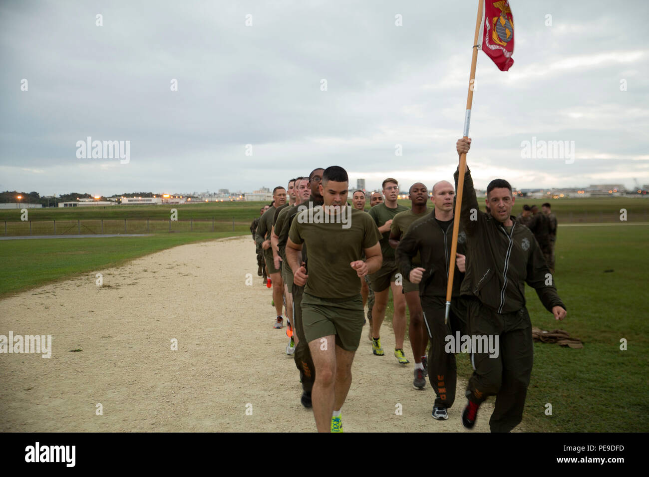 Master Sgt. Jason Annis raises the guidon in celebration as the Marines ...