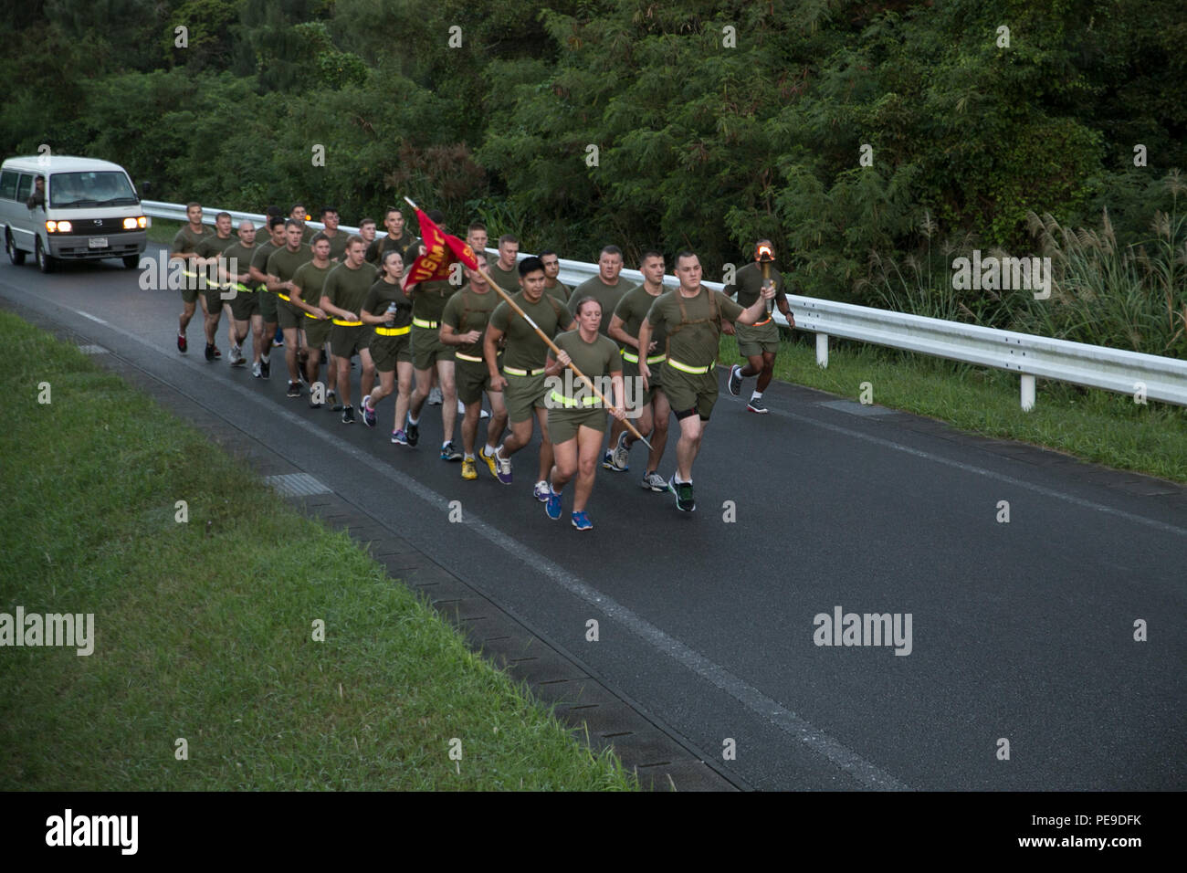 Marines with Headquarters and Support Battalion run with the Flame of ...