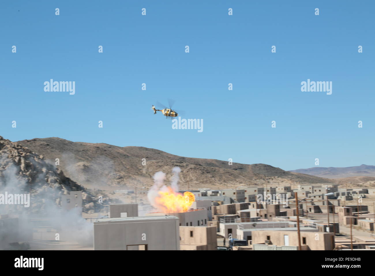 A UH-72 Lakota flies over a simulated explosion at the National Urban ...
