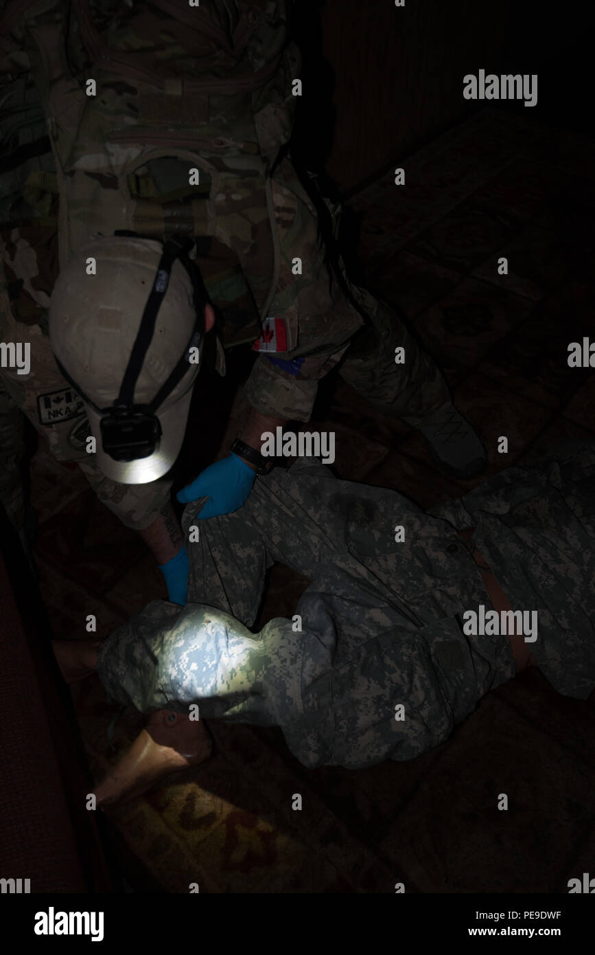 A member of the Canadian Special Operations Forces Command searches a ...