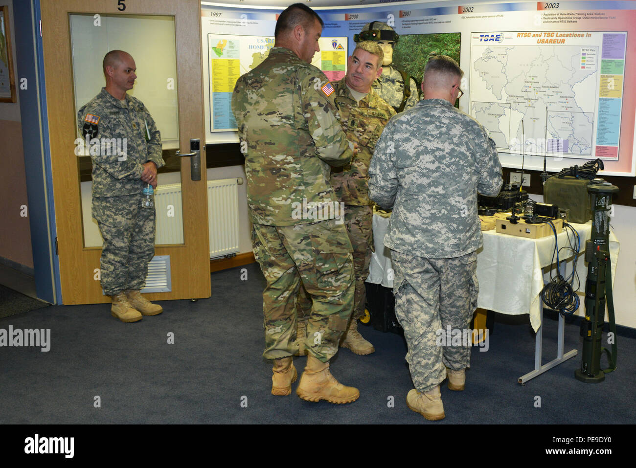 U.S. Army Command Sgt. Maj. Jeffrey Sweezer (center), the incoming ...
