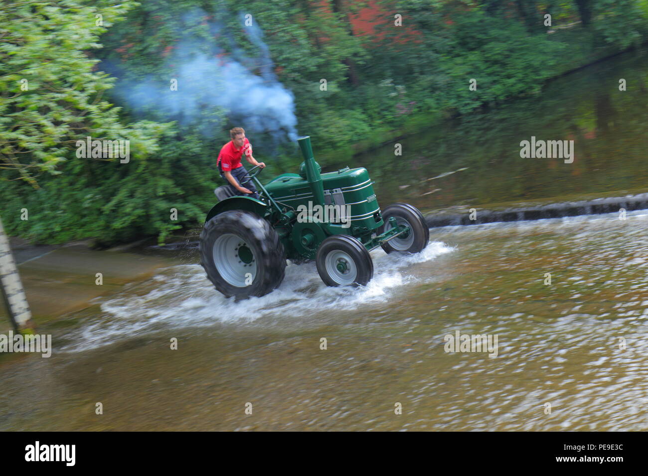 A tractor crosses the River Skell in Ripon as part of a convoy which ...
