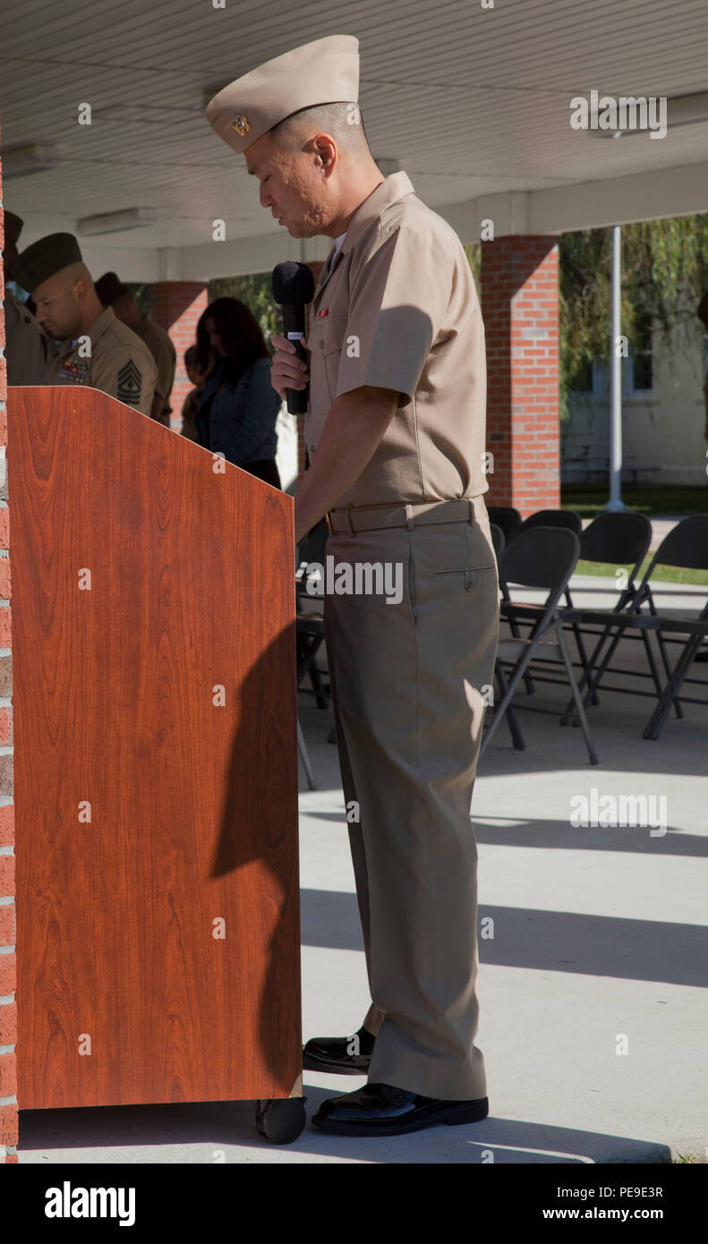 U.S. Navy Lt. Dwight Dunlap, chaplain, delivers an invocation during ...