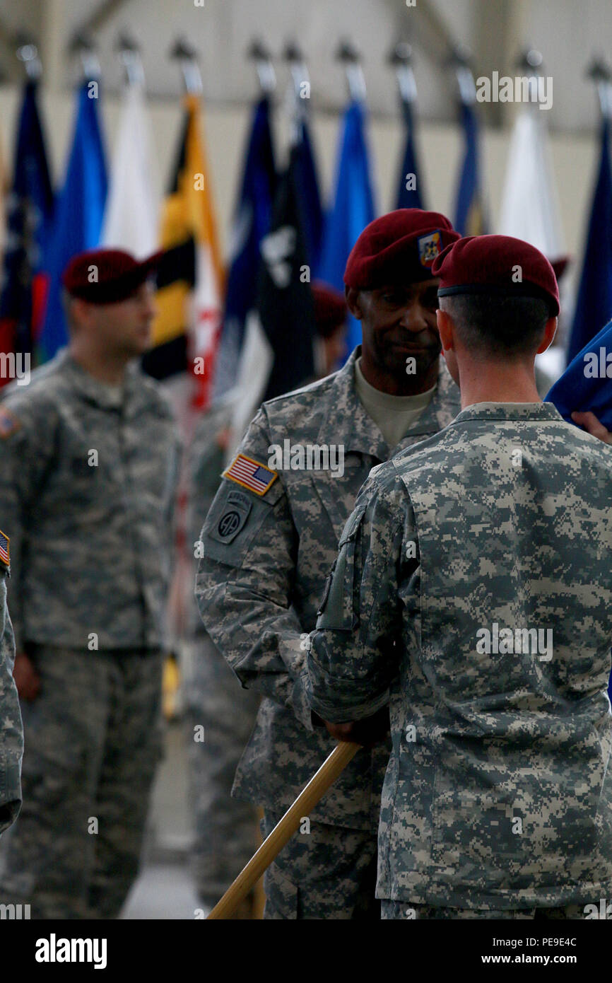 Command Sgt. Maj. Ronald Evans transfers the guidon to Lt. Col. Andrew ...