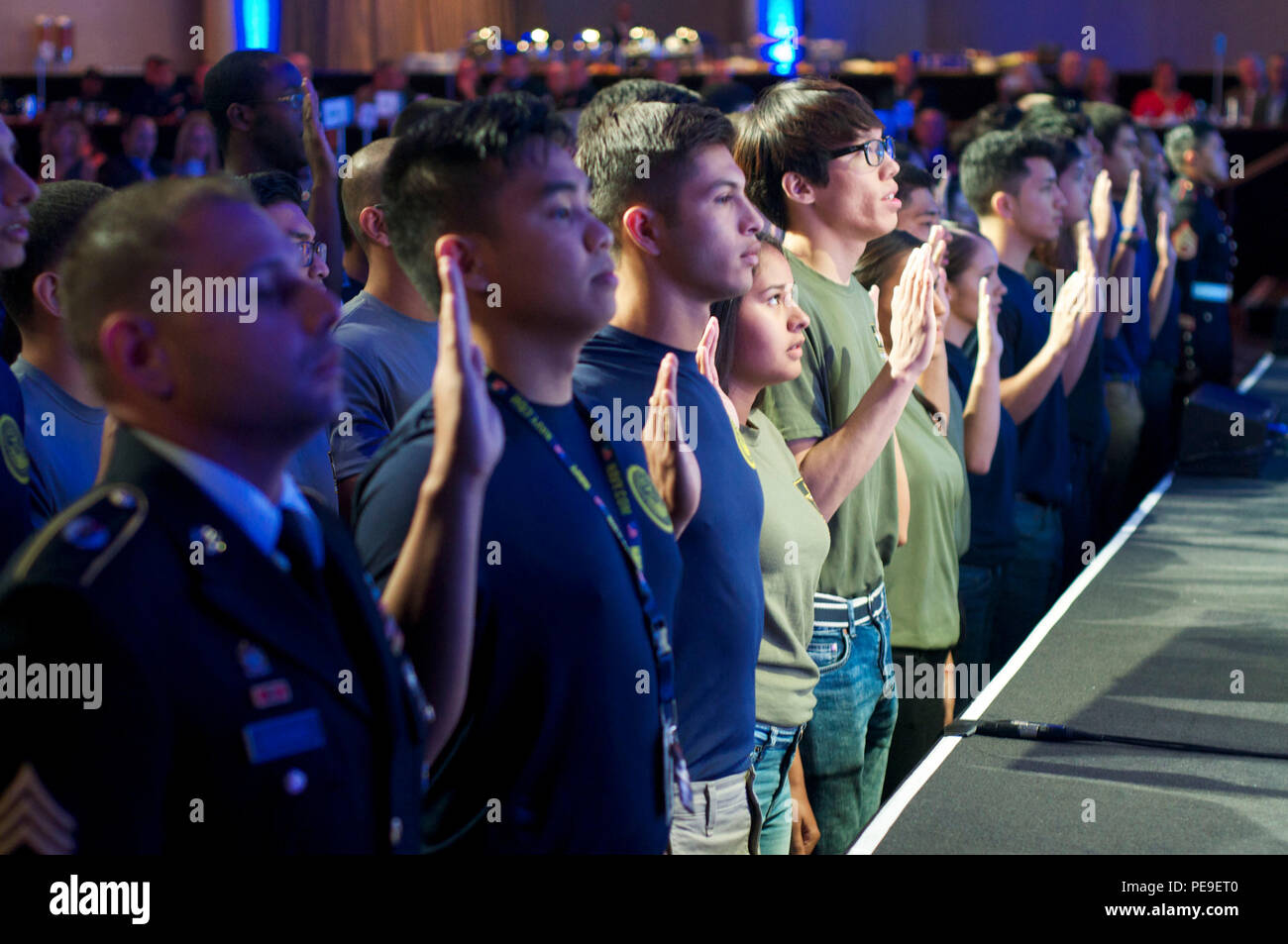 Recruits from all branches of the military “swear in” during an Oath of ...