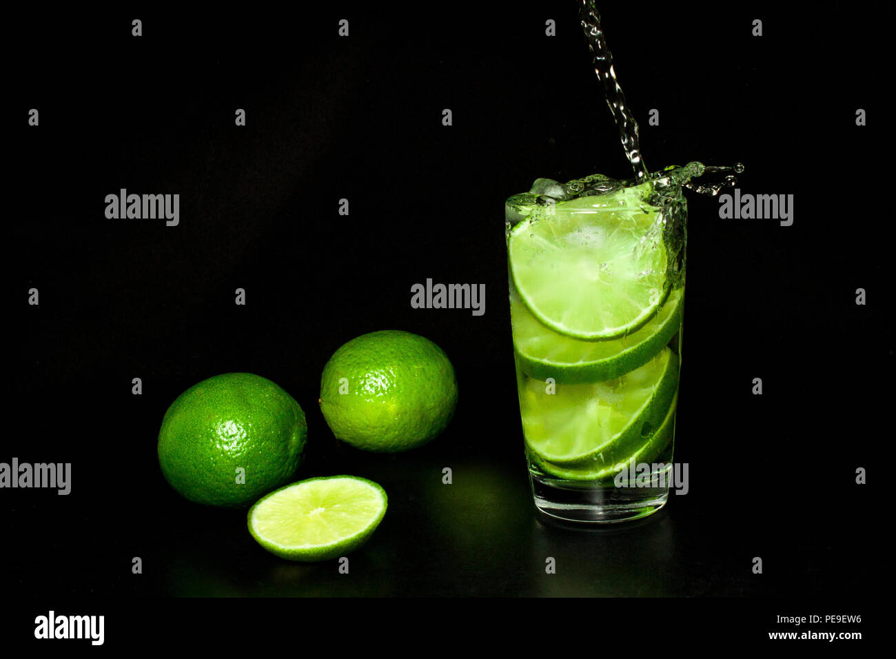 Summer refreshing and beverages concept. Glass of cold drink with ice ...