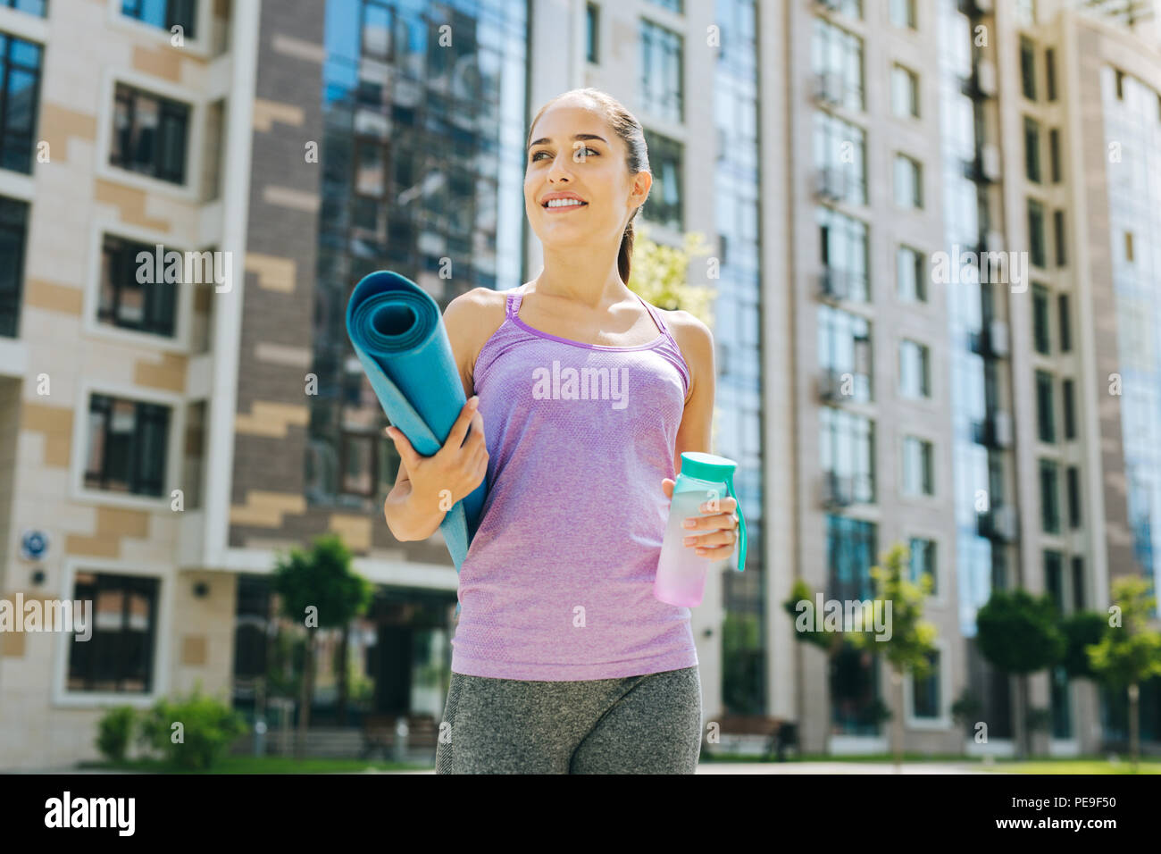 Positive fit woman smiling Stock Photo - Alamy