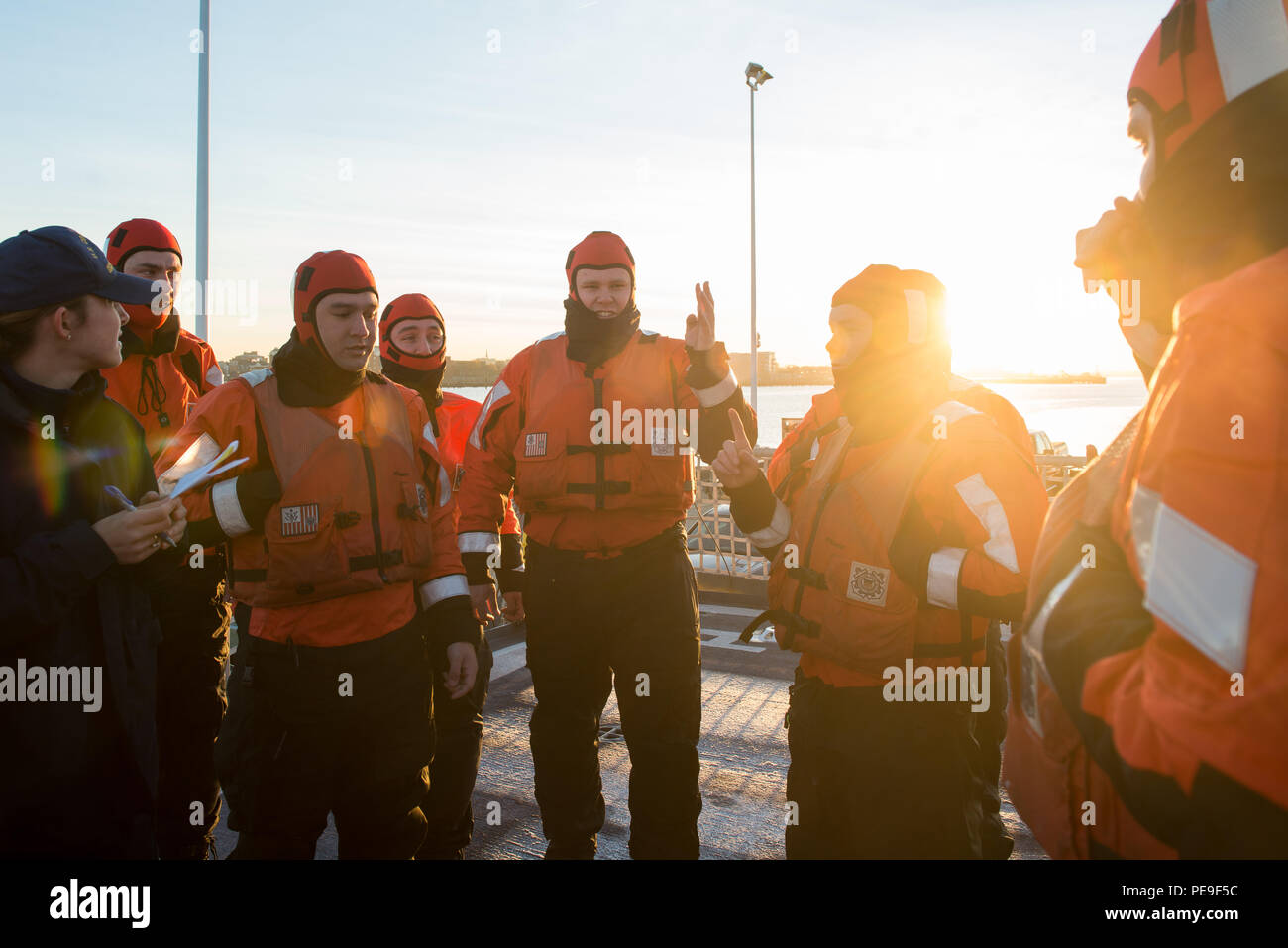 Crew members from the Coast Guard Cutter Spencer leak-test their ...