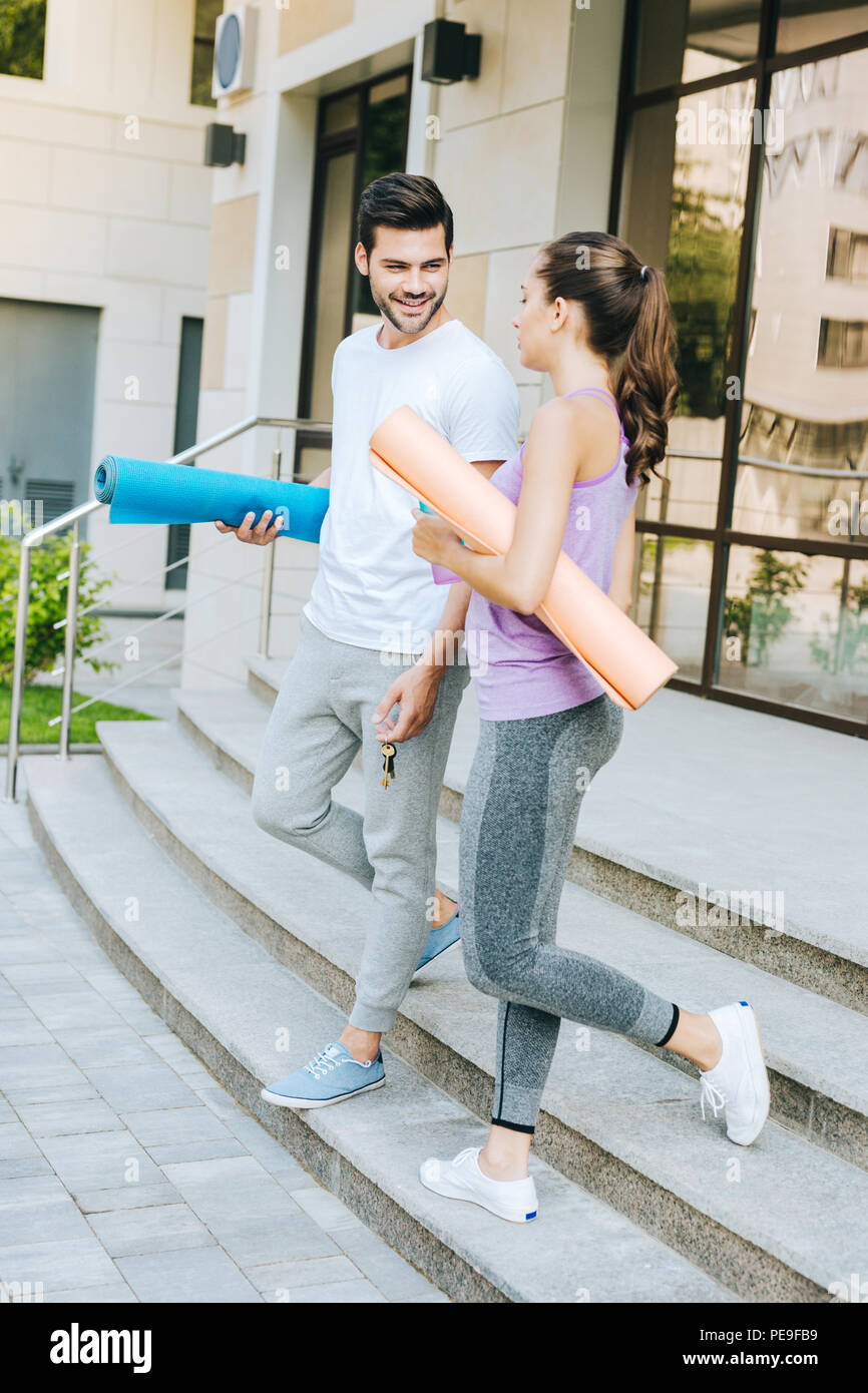 Positive nice people walking down the stairs Stock Photo - Alamy
