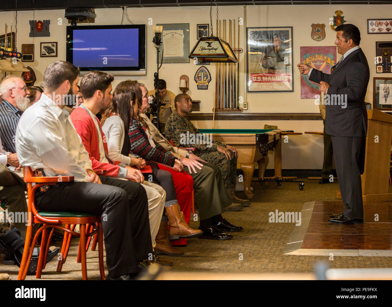 Retired U.S. Marine Corps Maj. Michael Lujan, right, speaks at the ...