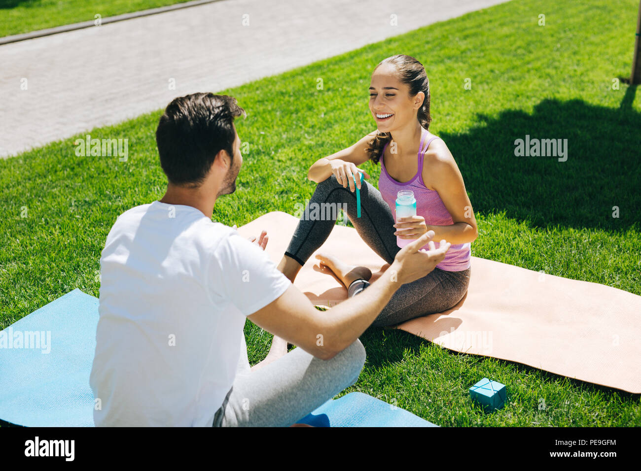 Joyful nice people smiling to each other Stock Photo - Alamy