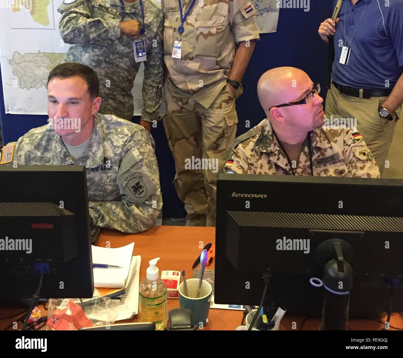Capt. Scott Saunders, U.S. Army Africa, receives an intelligence brief ...