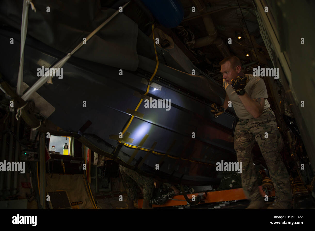 Loadmasters from the 9th Special Operations Squadron load a Maritime ...