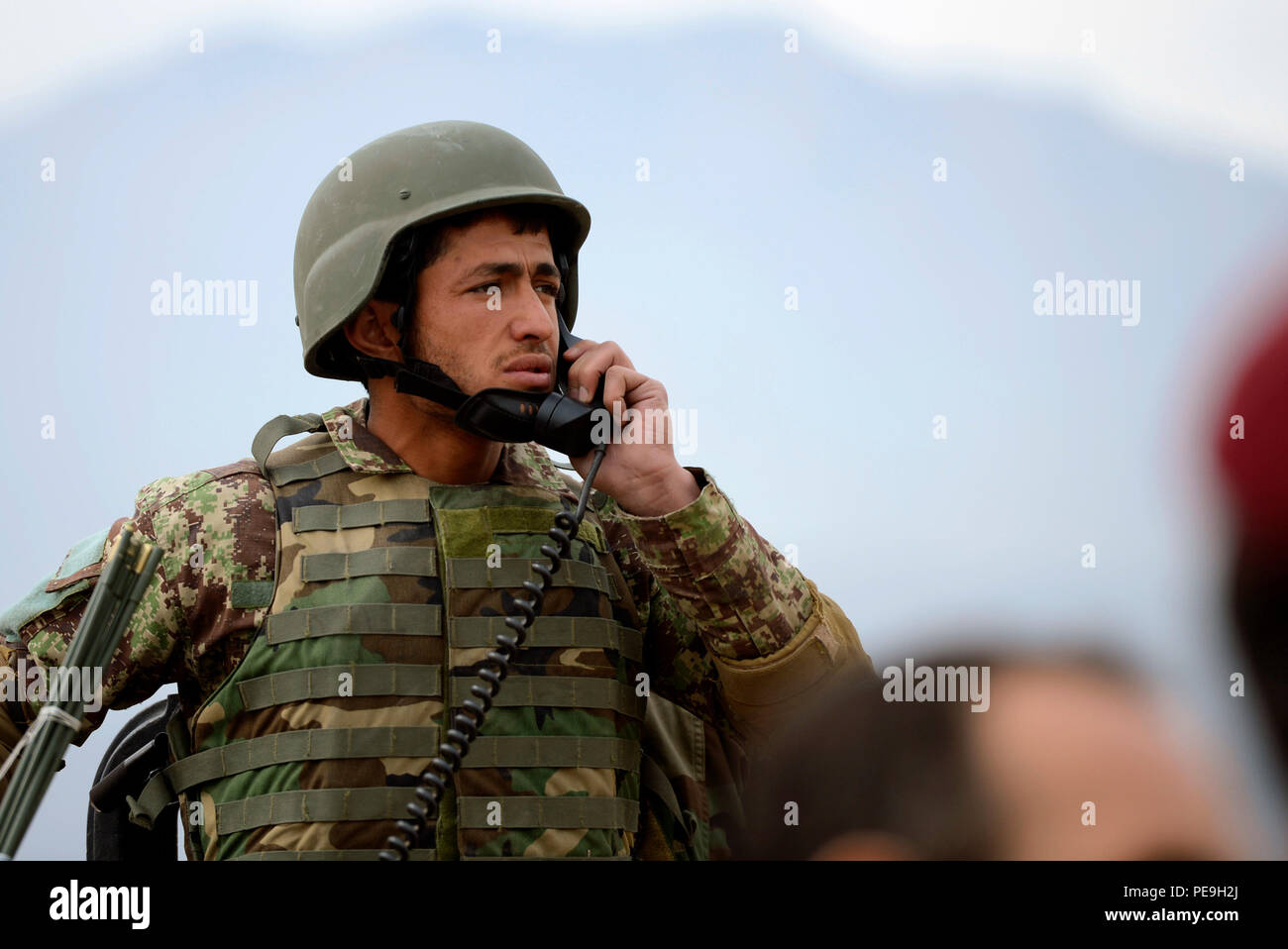 Afghan National Army commandos at Camp Morehead, Afghanistan, fire the ...