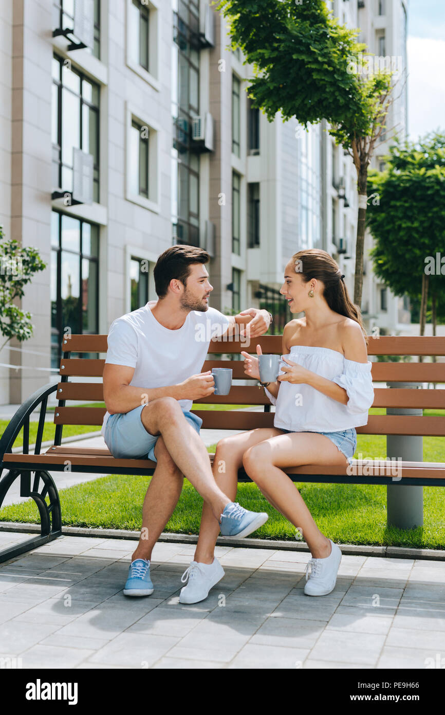 Joyful positive people having a conversation Stock Photo - Alamy
