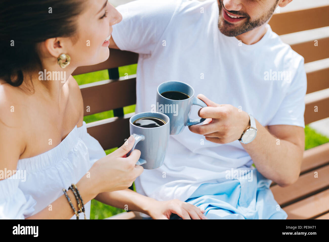 Happy nice people looking at each other Stock Photo - Alamy