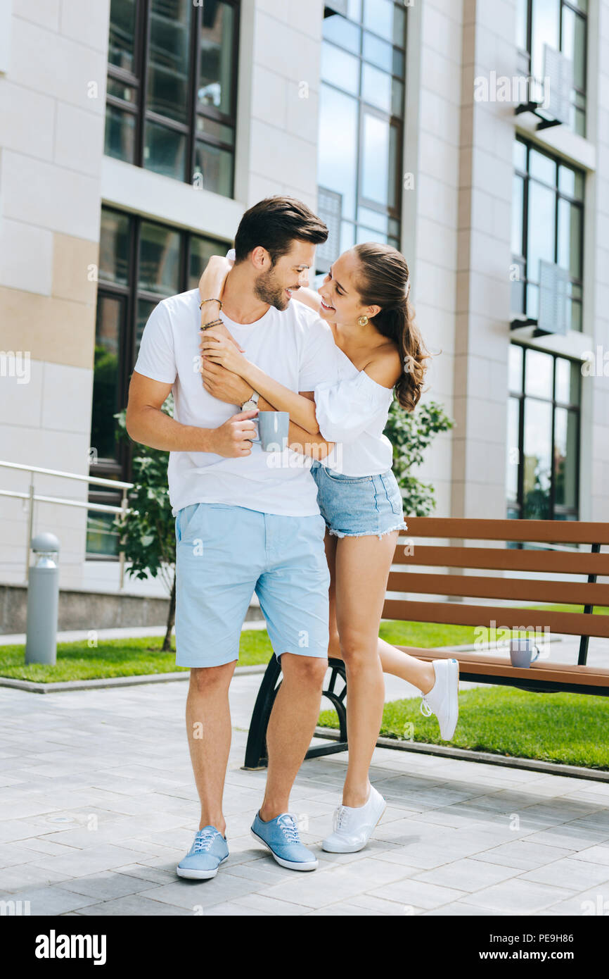 Joyful happy woman hugging her husband Stock Photo - Alamy
