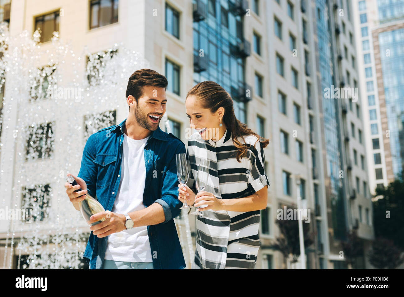 Nice happy woman waiting for champagne Stock Photo - Alamy