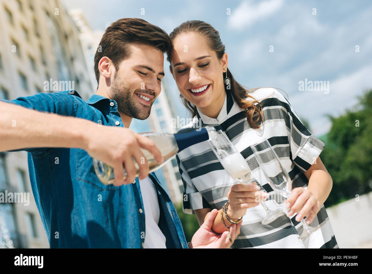 Delighted nice couple standing hi-res stock photography and images - Alamy