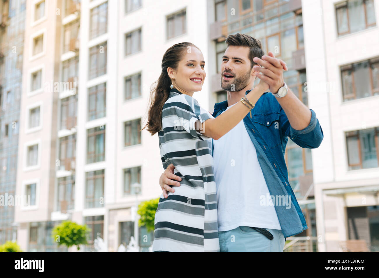 Joyful delighted couple dancing Stock Photo - Alamy