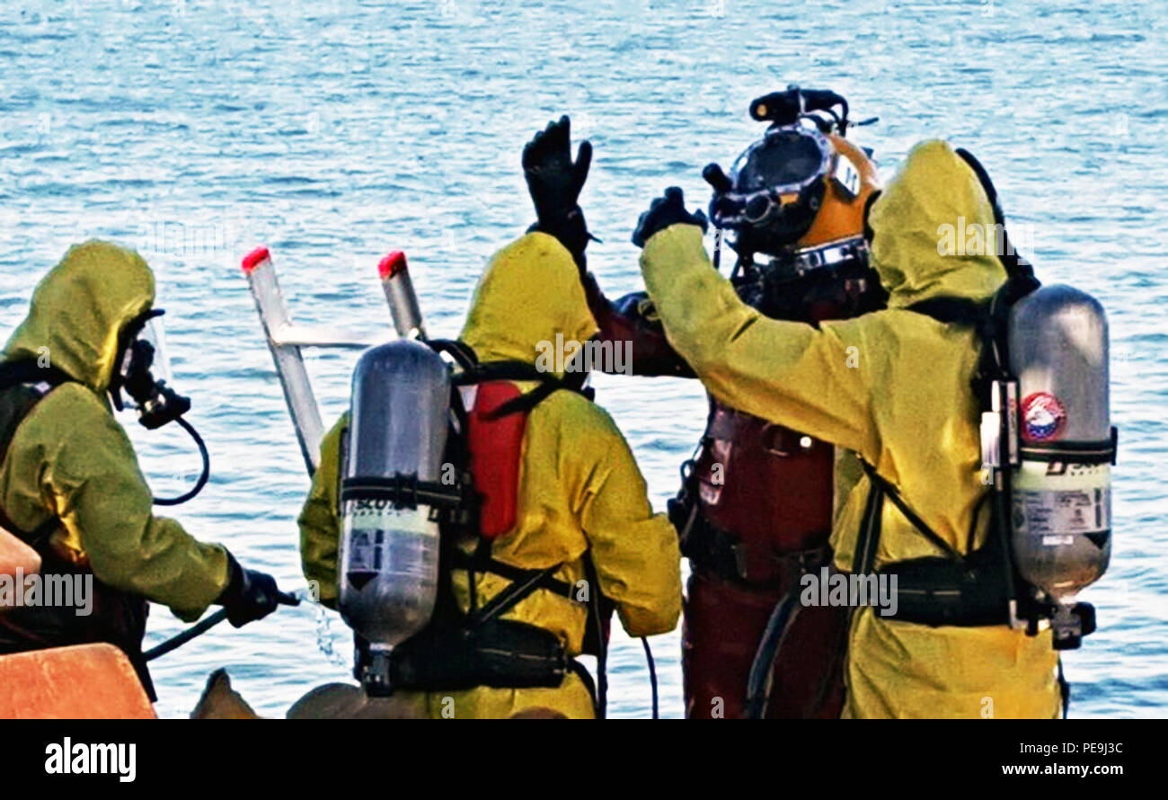 Responders aboard a work barge for the Lake Erie Barge Argo response ...