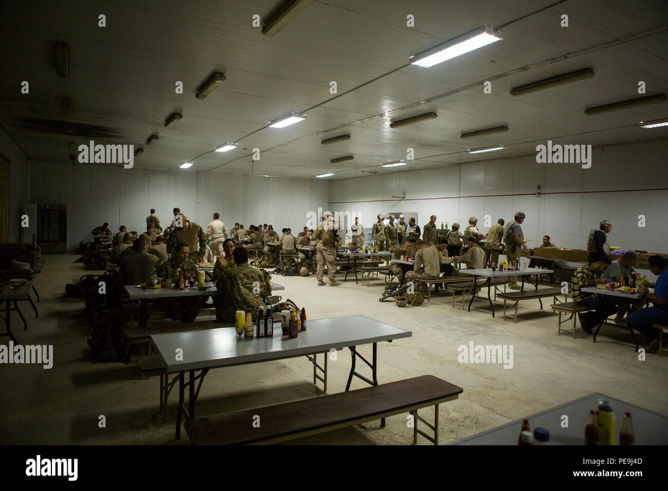 U.S. service members with Task Force Al Taqaddum sit down for a meal ...
