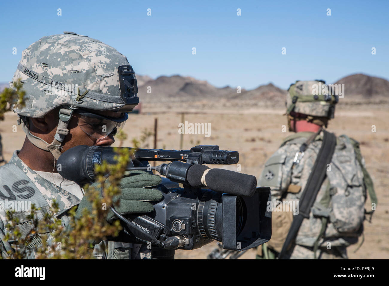 U.S. Army Pvt. Michael Crews assigned to Vulture Team, Operations Group, shoots video of 1st ...