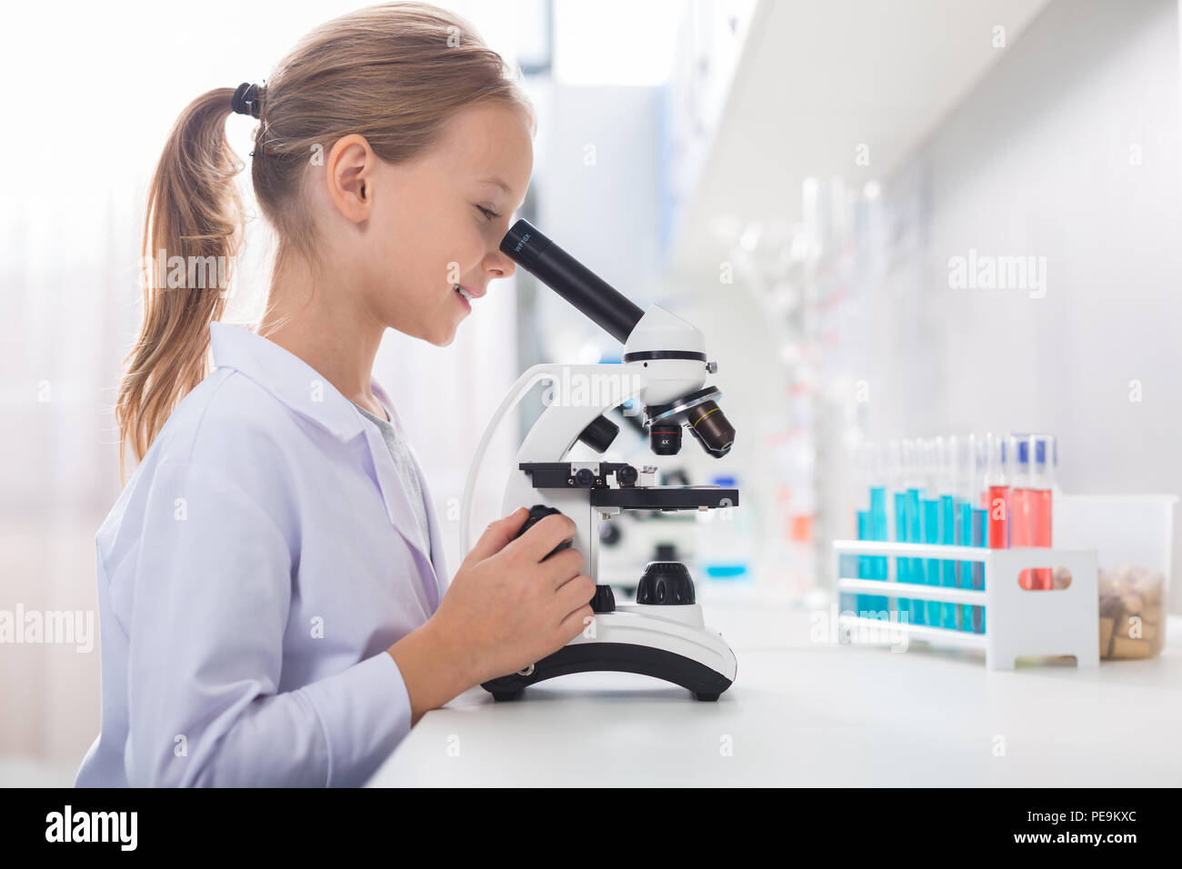 Great instrument. Appealing ambitious beautiful girl posing in profile ...