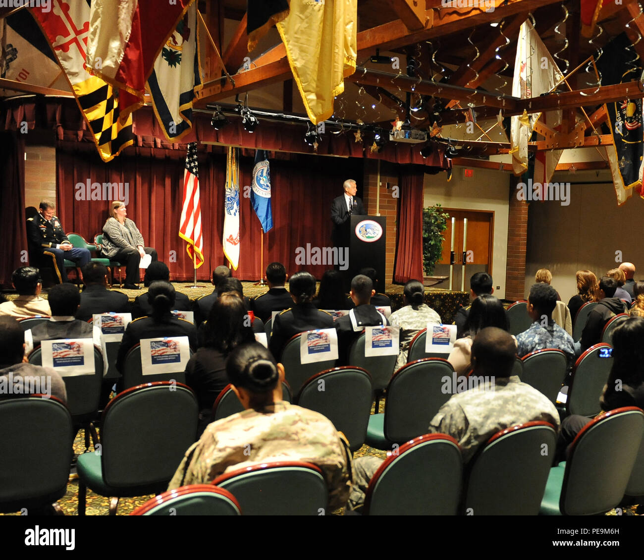 Colonel Daniel Morgan, Commander Joint Base Lewis McChord, listens as U ...