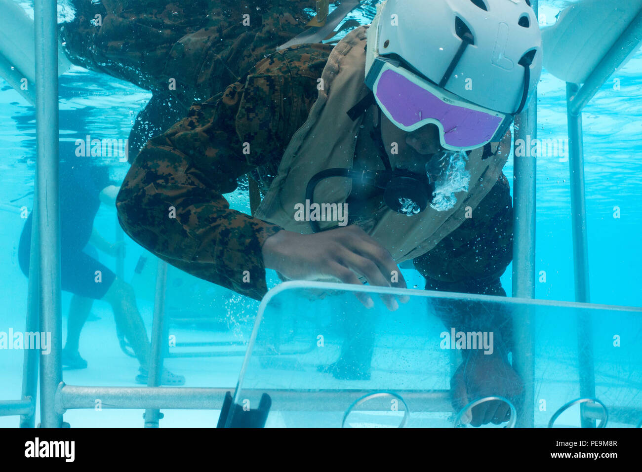 Lance Cpl. Carl King escapes the Shallow Water Egress Training chair ...