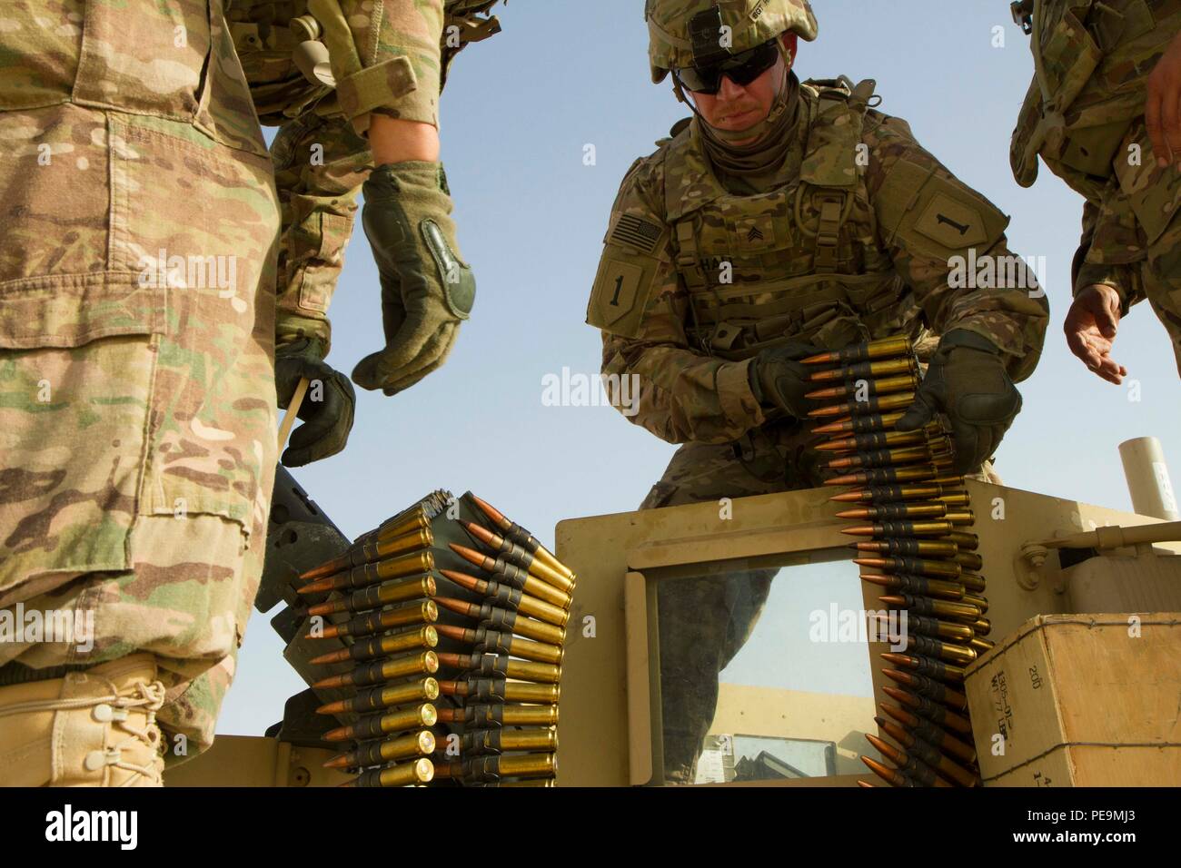Sgt. Michael Hall with 1st Battalion, 18th Infantry Regiment, loads the ...
