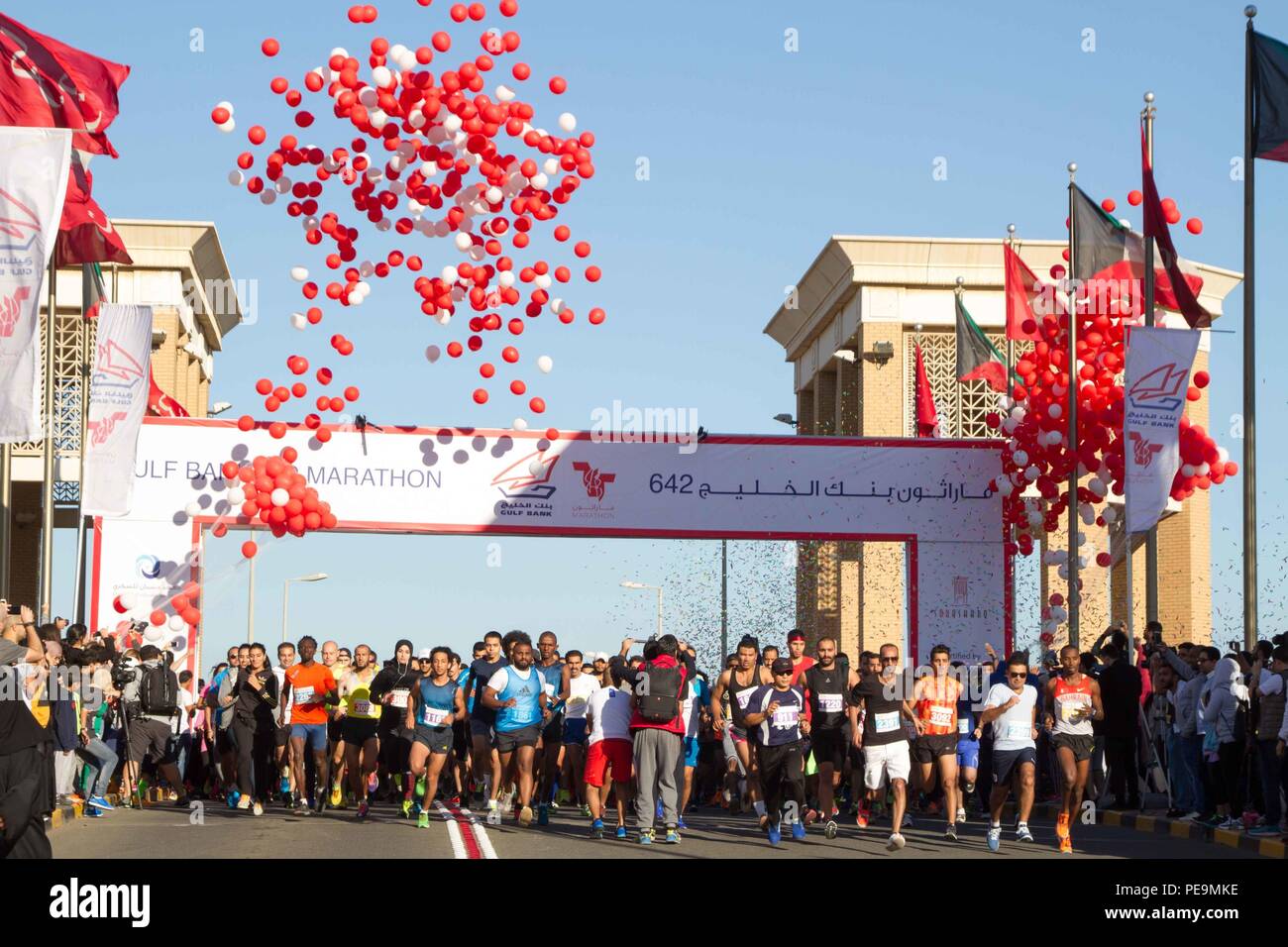Participants of the Gulf Bank 642 Marathon line up at the starting line ...