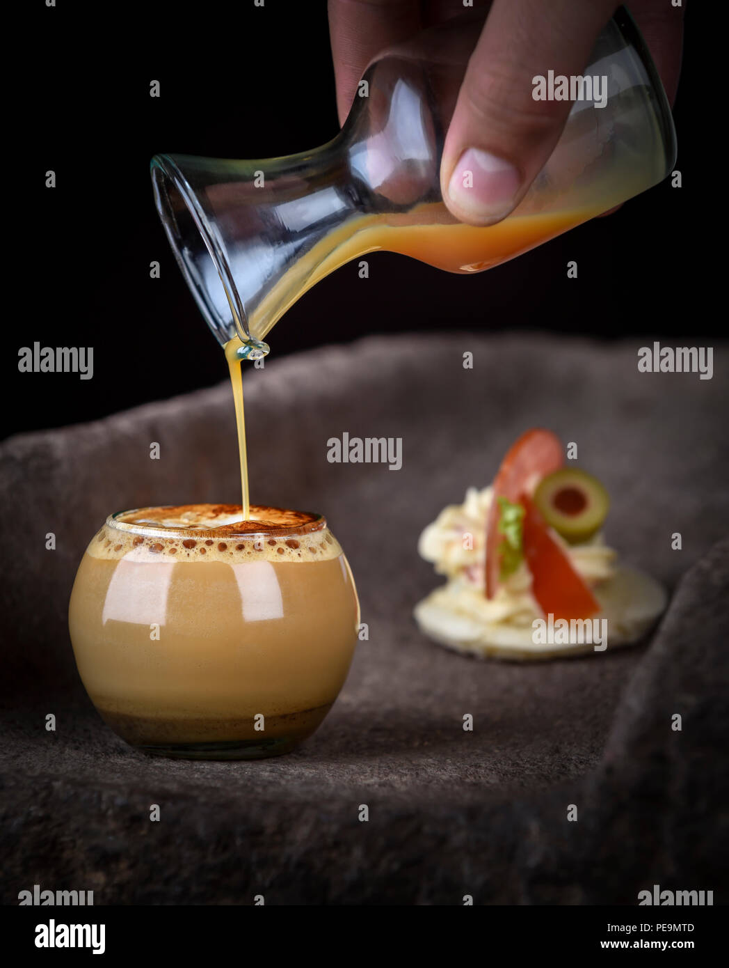 delicious coffee with milk accompanied by canapé Stock Photo - Alamy