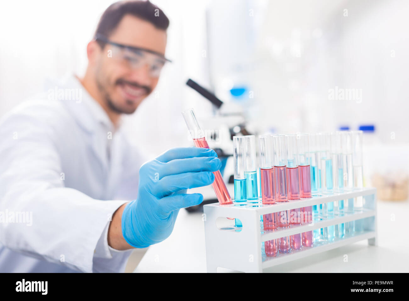 Safety and work. Selective focus of male hand dressing in glove taking ...