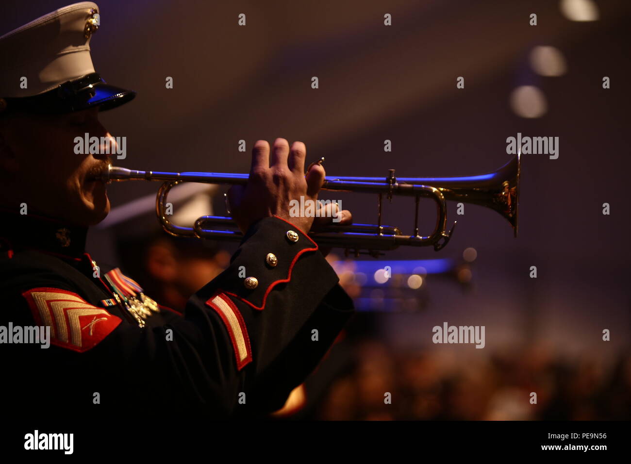 A U.S. Marine with the 1st Marine Division band plays his trumpet ...