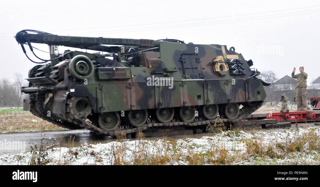 An M88 Hercules tank is off loaded from a trailer on Nov. 24, 2015, in ...